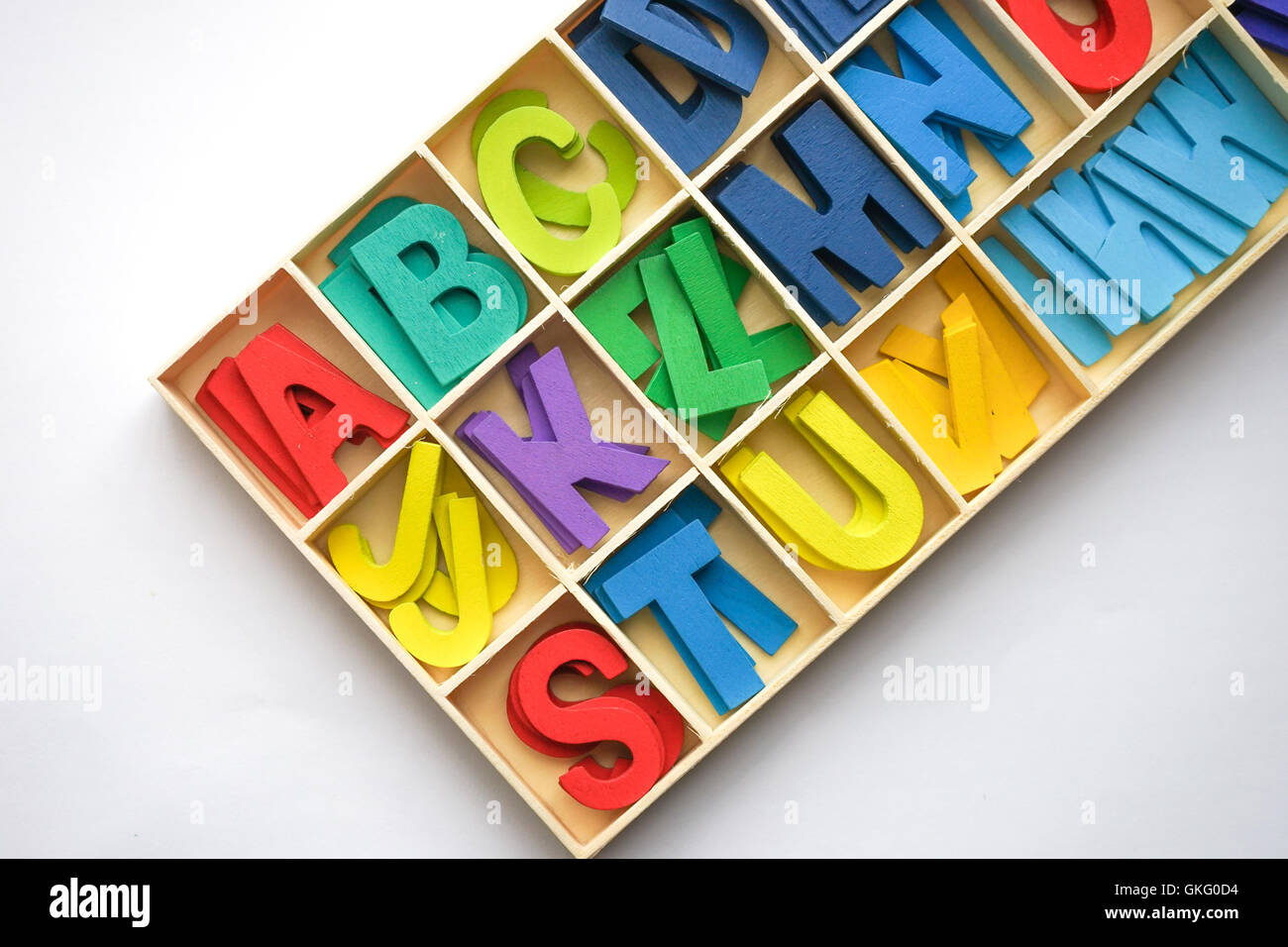 Colorful wooden letter with white background Stock Photo - Alamy