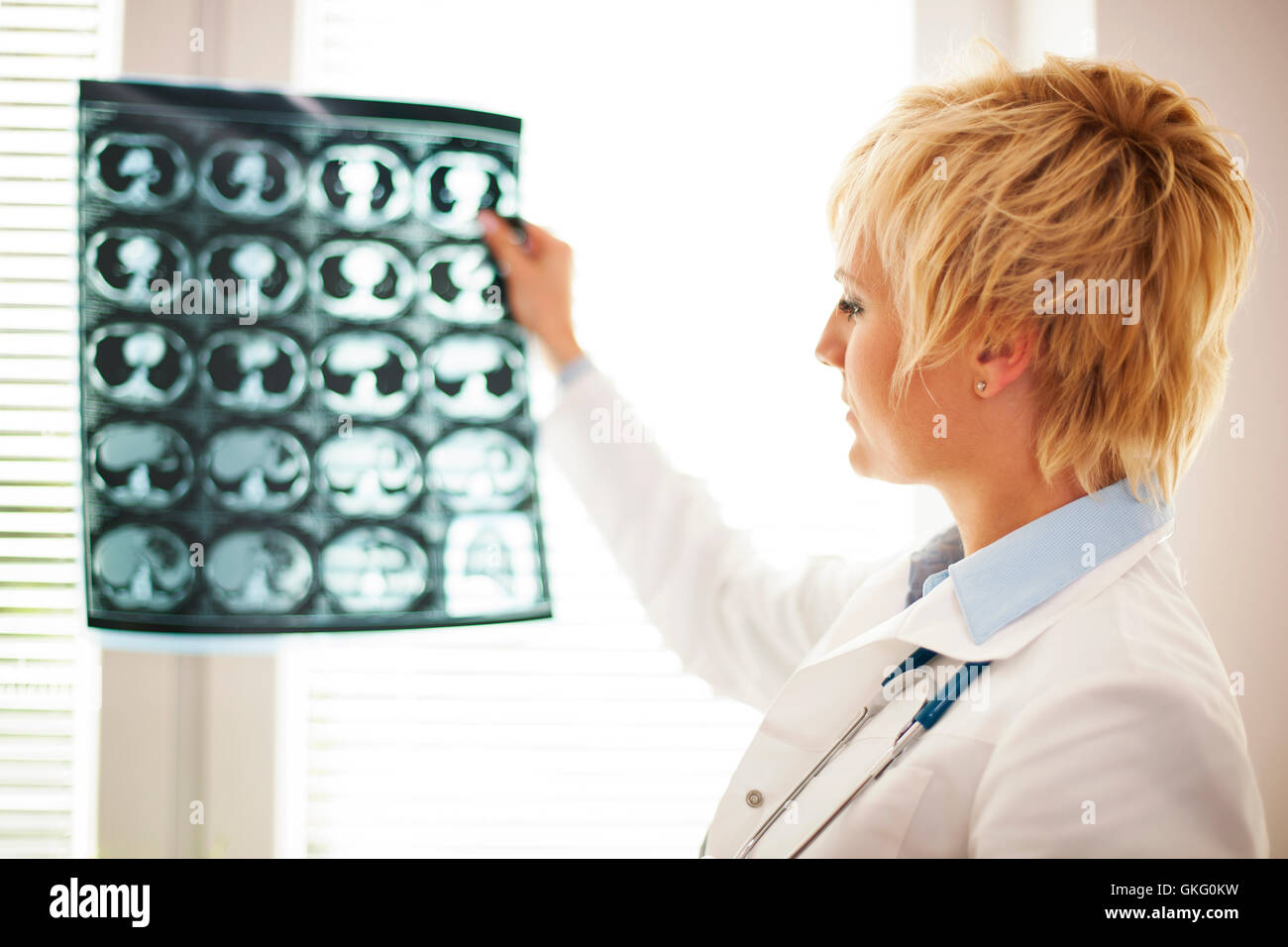 Doctor studying scan hi-res stock photography and images - Alamy