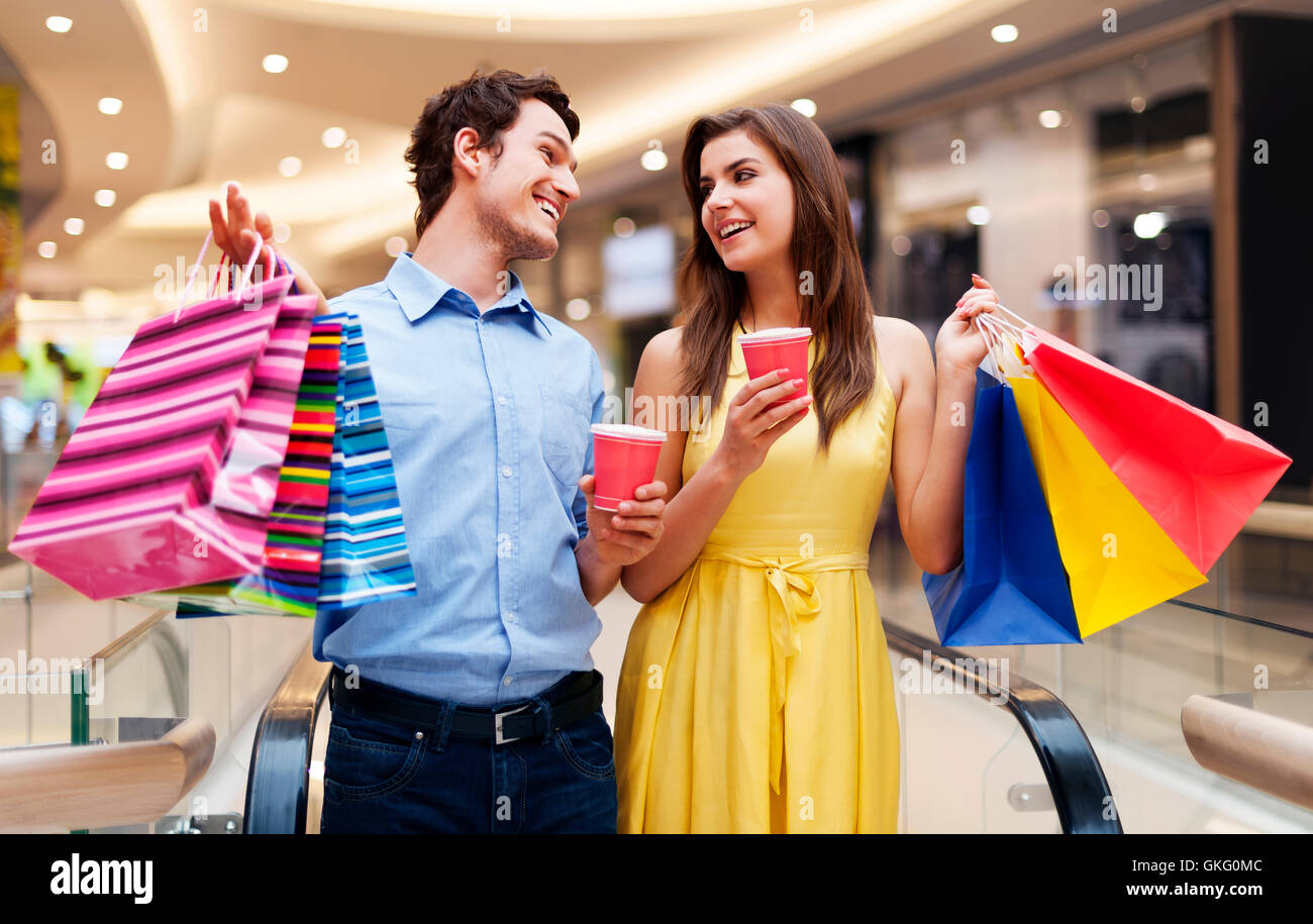 Woman laughs holding shopping hi-res stock photography and images - Alamy
