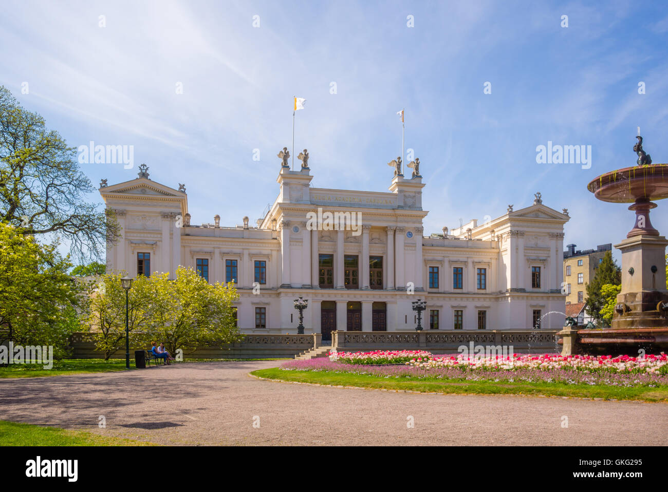 Students siting in the park in front of Lund University Stock Photo - Alamy