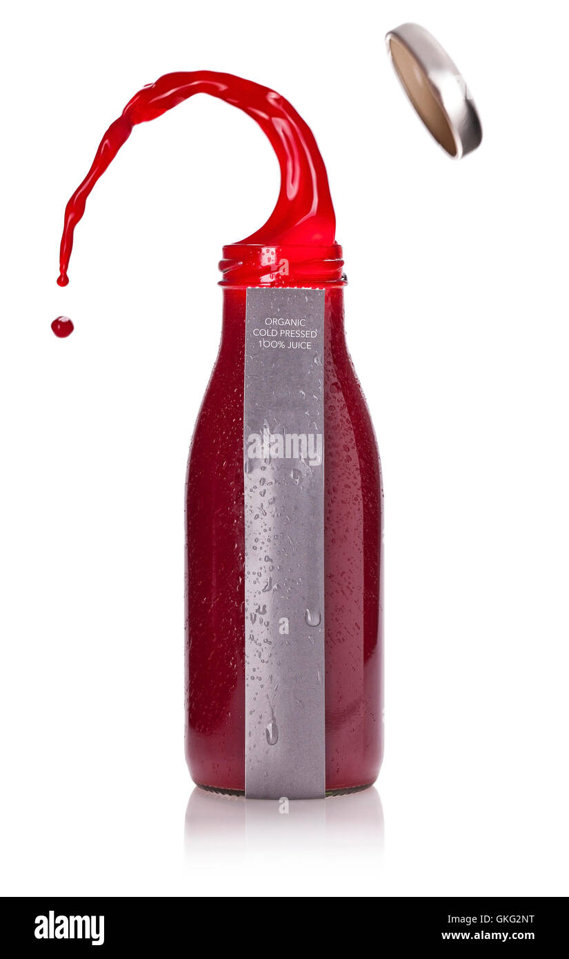 Bottle of juicy red liquid with blank label and popped cap isolated ...