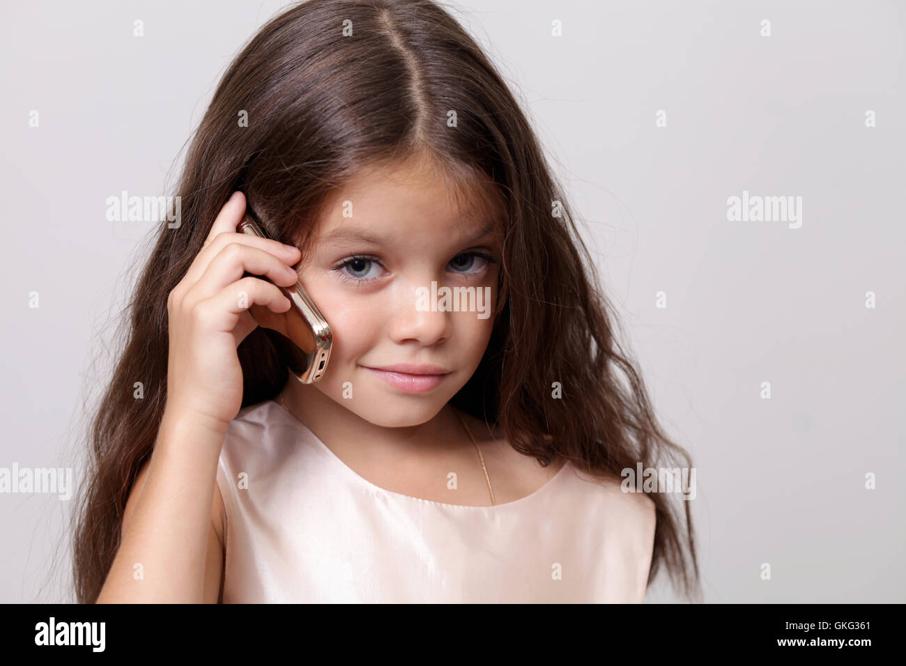 little girl calling by phone Stock Photo - Alamy
