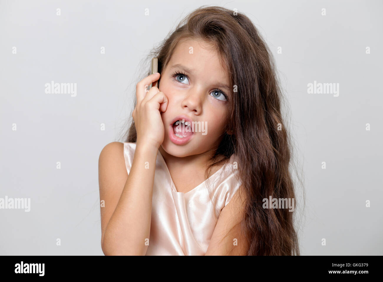 little girl calling by phone Stock Photo - Alamy
