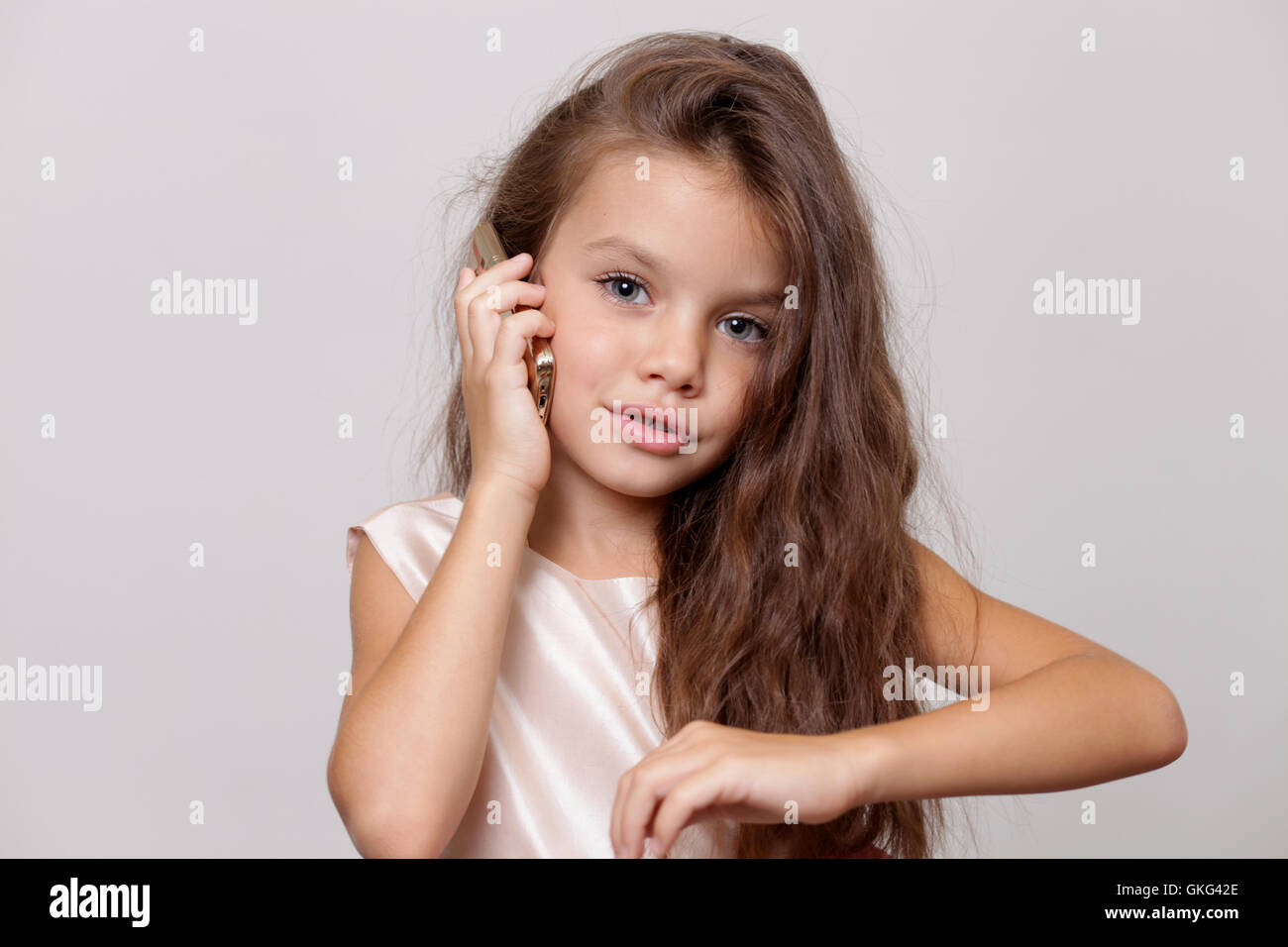 little girl calling by phone Stock Photo - Alamy