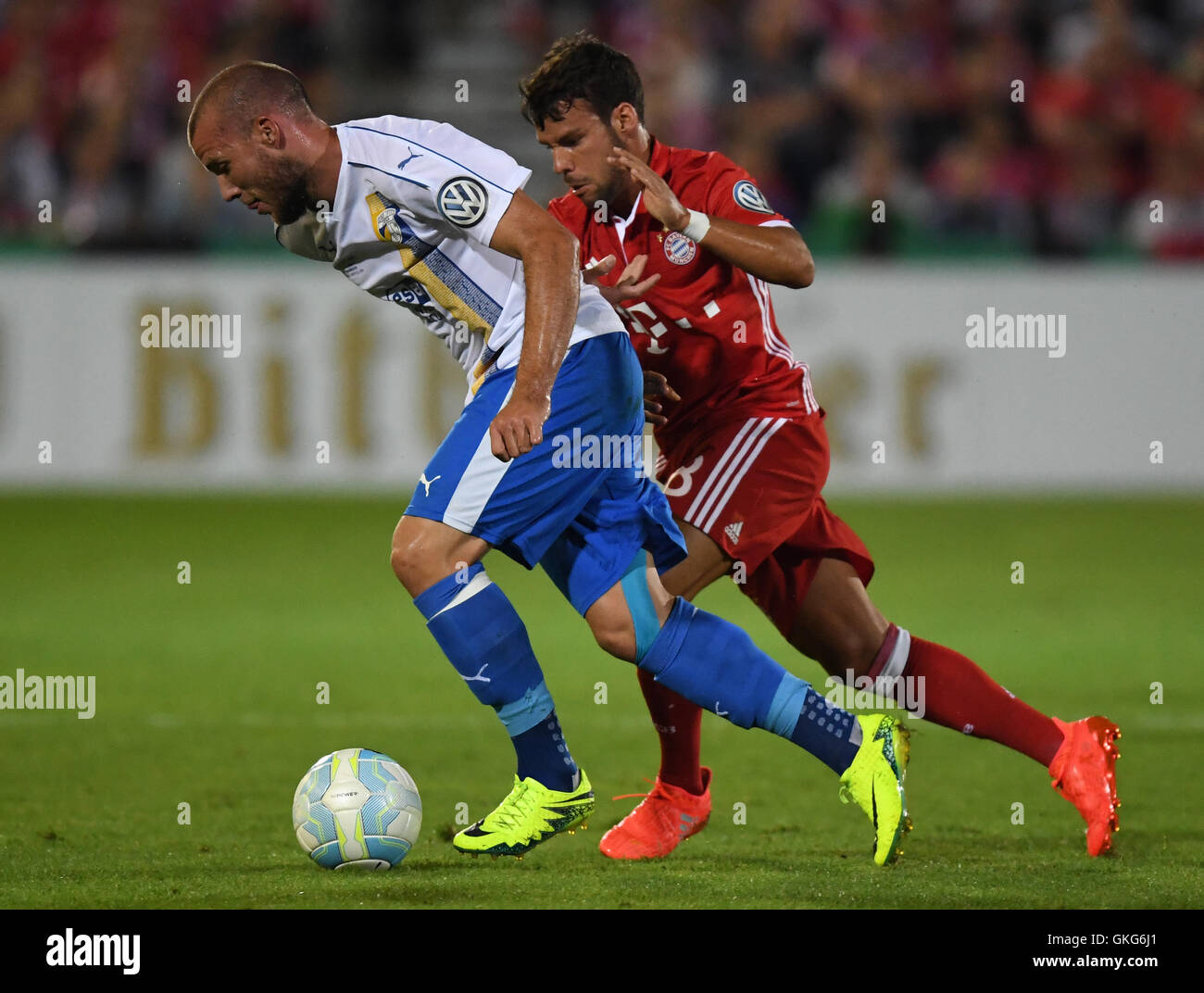 Jena, Germany. 19th Aug, 2016. Bayern's Juan Bernat (r) and Jena's ...