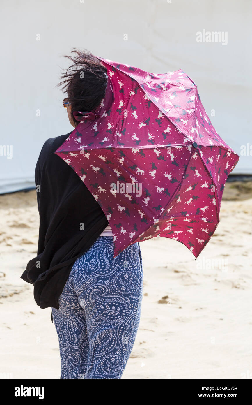 Strong wind umbrella hi-res stock photography and images - Alamy