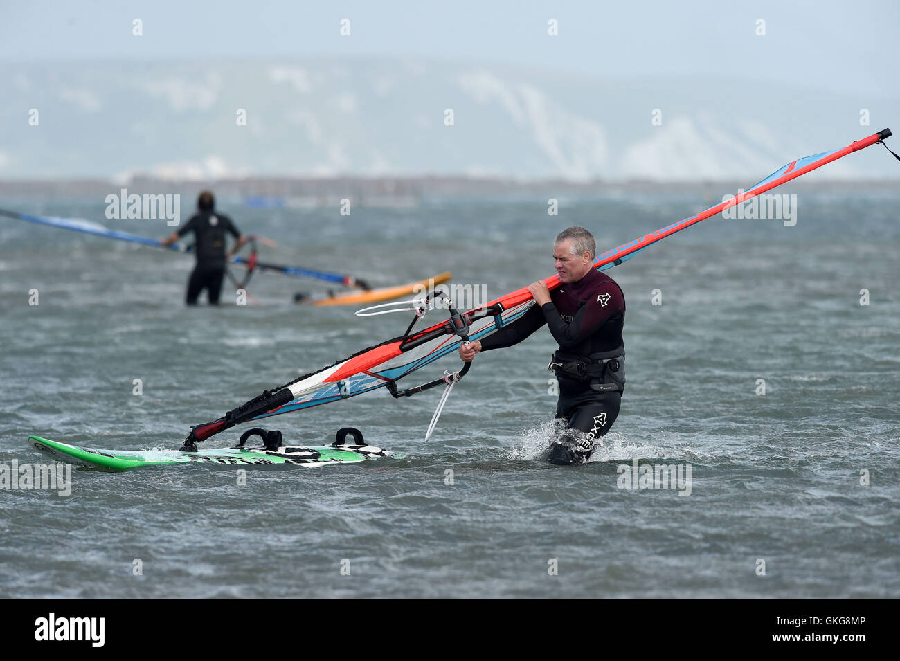 Windsurfers in Portland harbour, Dorset, UK Stock Photo - Alamy