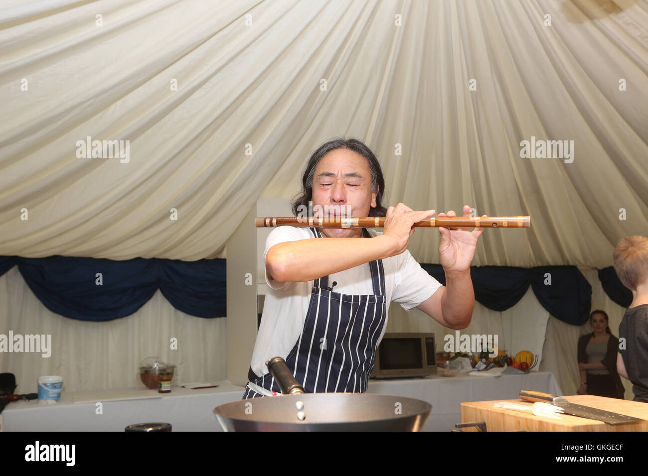 Rochdale, UK. 20th August, 2016. Guo Yue playing a Bawu ,a Chinese free ...