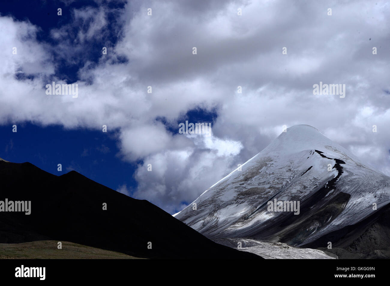 Golmud, Qinghai, China. 21st Aug, 2016. The snow-covered Yuzhu Peak of ...