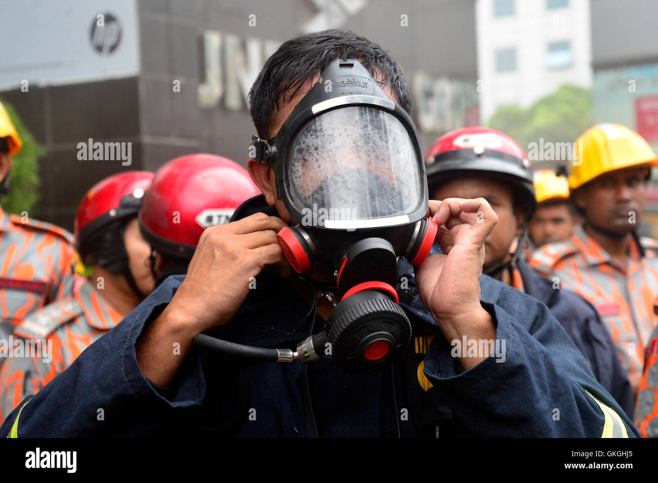 Bangladeshi firefighters work to douse a fire at the Bashundhara City ...