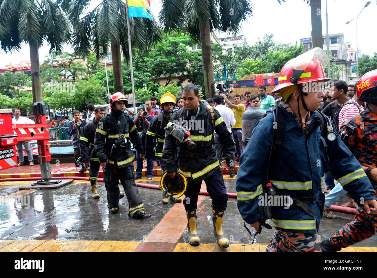 Bangladeshi firefighters work to douse a fire at the Bashundhara City ...