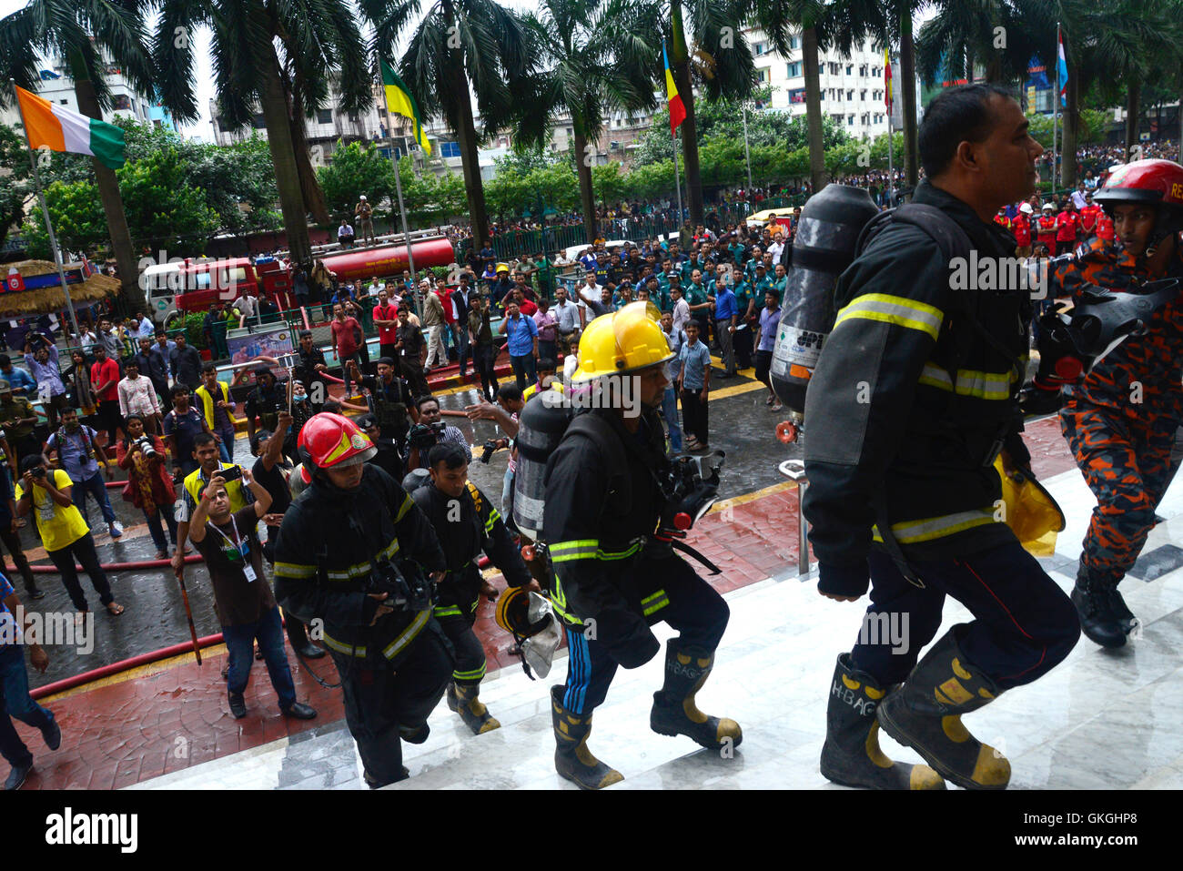 Bangladeshi firefighters work to douse a fire at the Bashundhara City ...