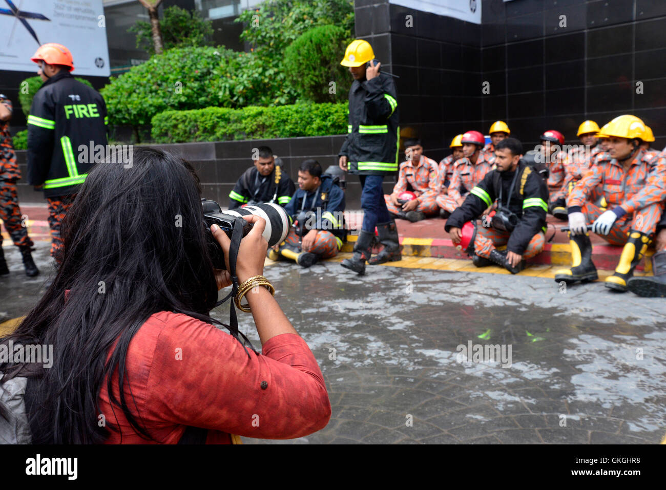 Bangladeshi firefighters work to douse a fire at the Bashundhara City ...