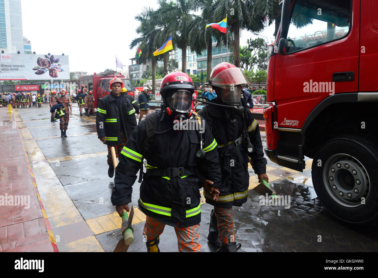 Bangladeshi firefighters work to douse a fire at the Bashundhara City ...