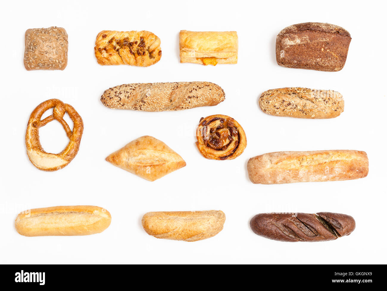 set from various freshly baked buns and loaves on white background ...