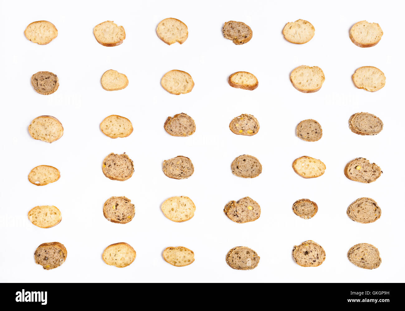 many sliced bread baguettes on white background Stock Photo - Alamy
