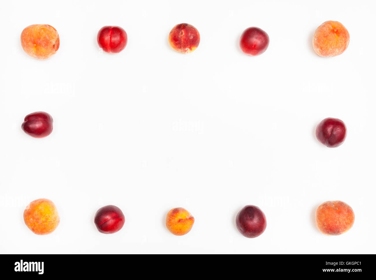 frame from ripe nectarines and peaches on white background Stock Photo ...