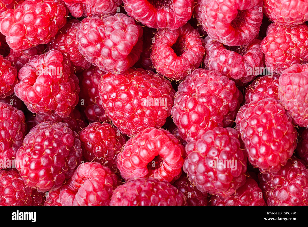 food background - many berries of ripe raspberry close up Stock Photo ...