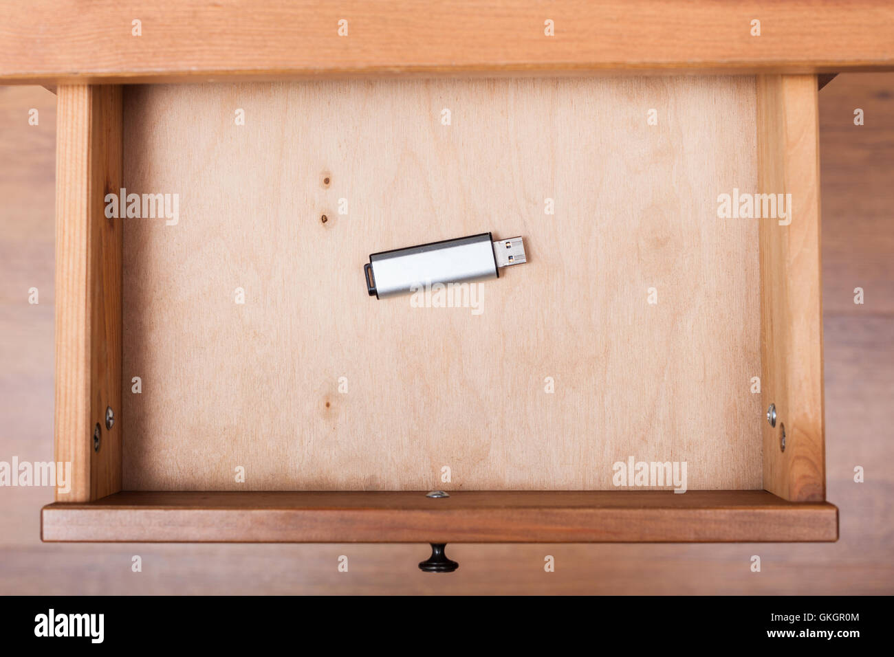 top view of flash drive in open drawer of nightstand Stock Photo - Alamy