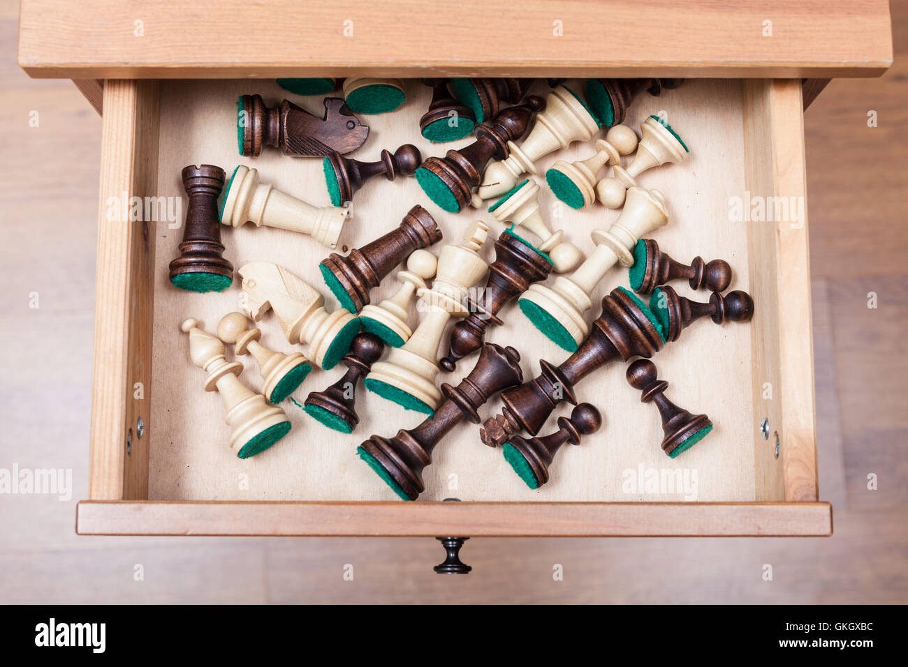 above view of chess pieces in open drawer of nightstand Stock Photo - Alamy