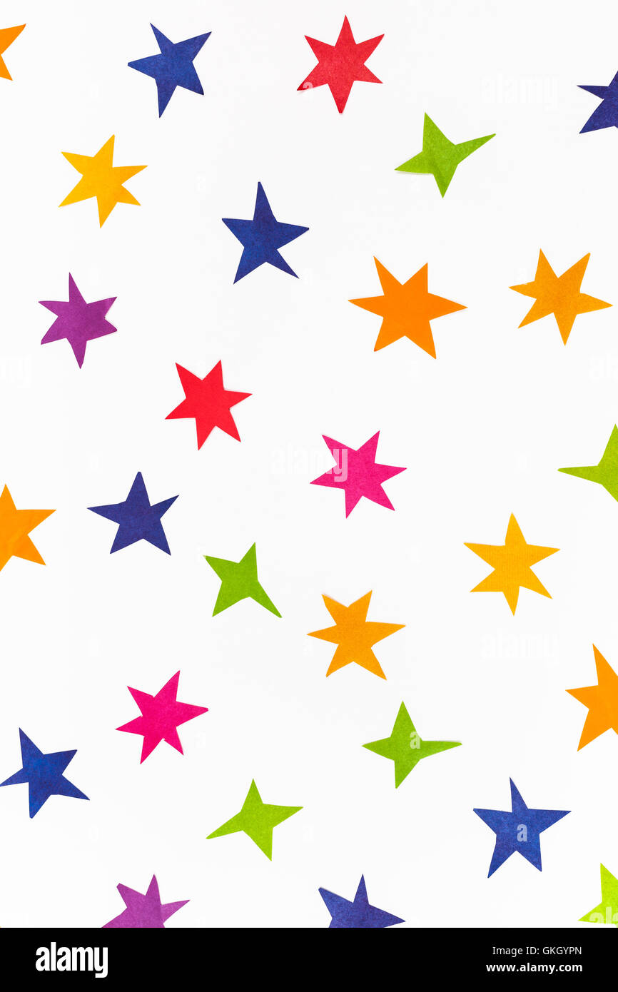 various stars cut out from colored paper on white background Stock ...