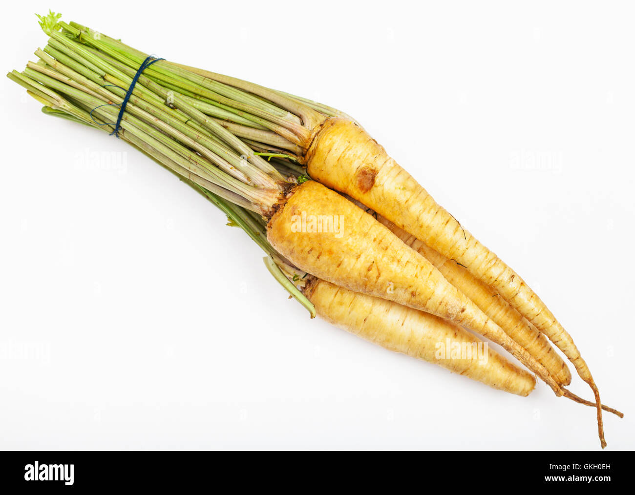 bunch of fresh cut parsley roots on white background Stock Photo - Alamy