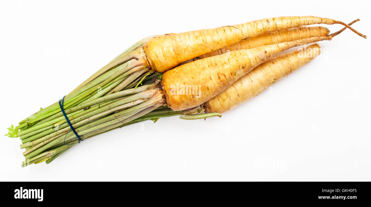bunch of fresh parsley roots on white background Stock Photo - Alamy
