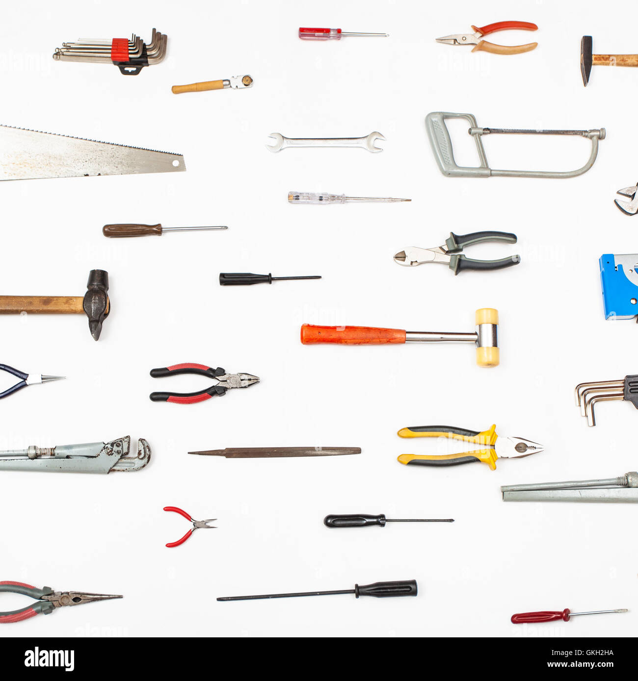 many small tools arranged on white background Stock Photo - Alamy