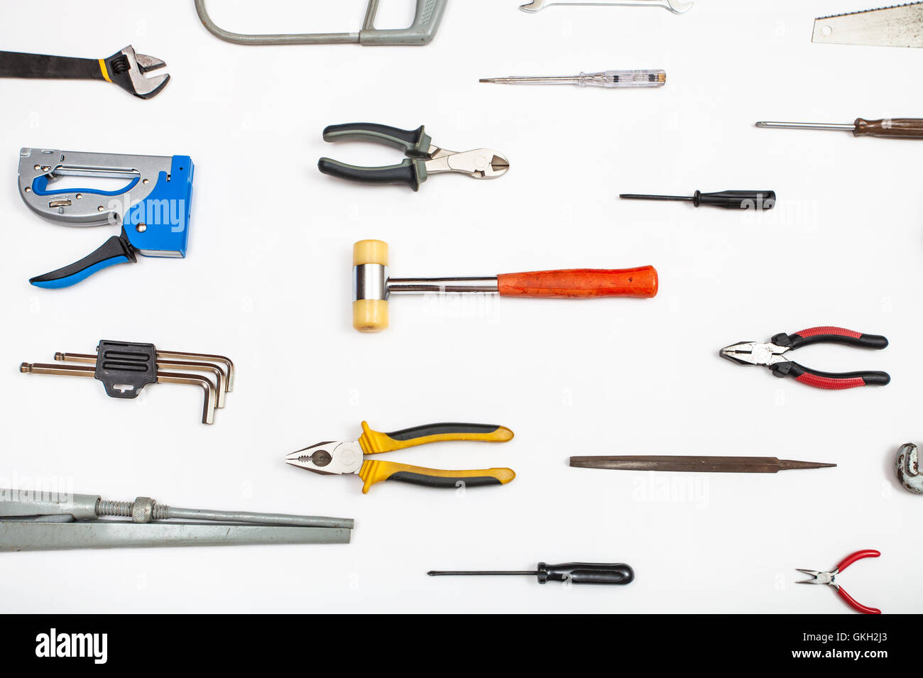 various hand tools arranged on white background Stock Photo - Alamy
