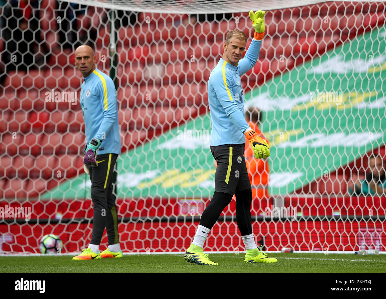 Manchester City's Joe Hart and Willy Caballero (left) warm up before ...