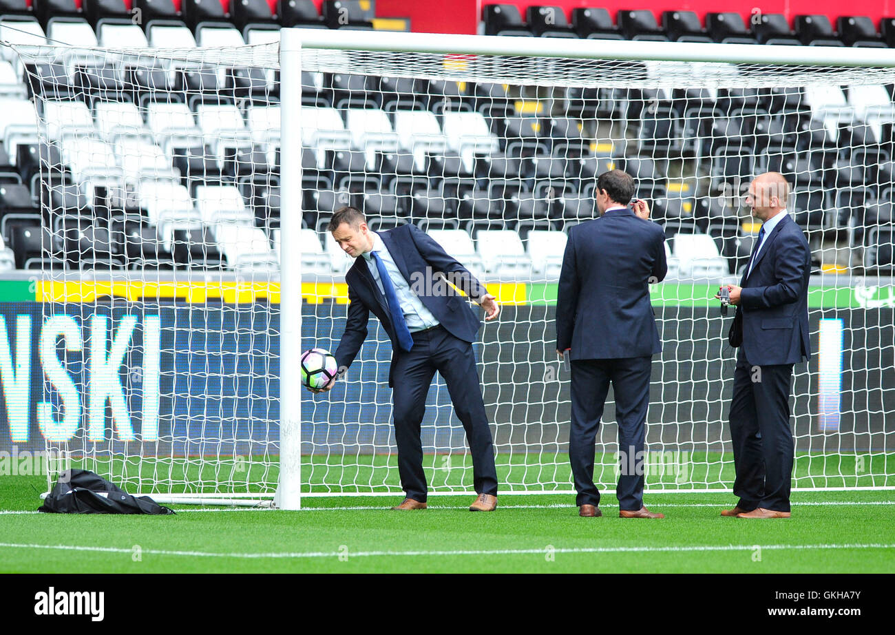 Officials test the goal line technology before the Premier League match ...