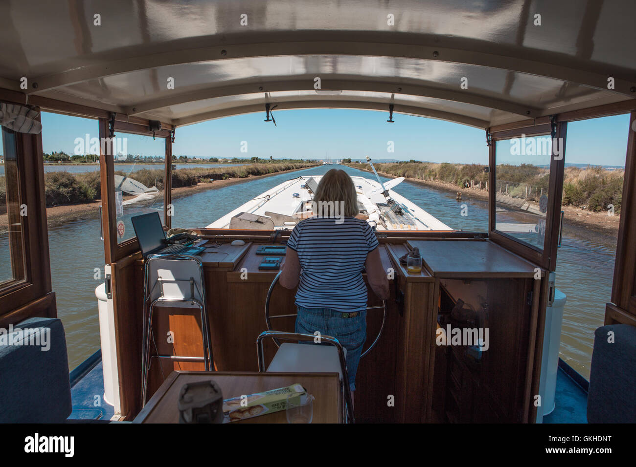 Lady driving barge on the can Du Rhone a Sete, France Stock Photo - Alamy