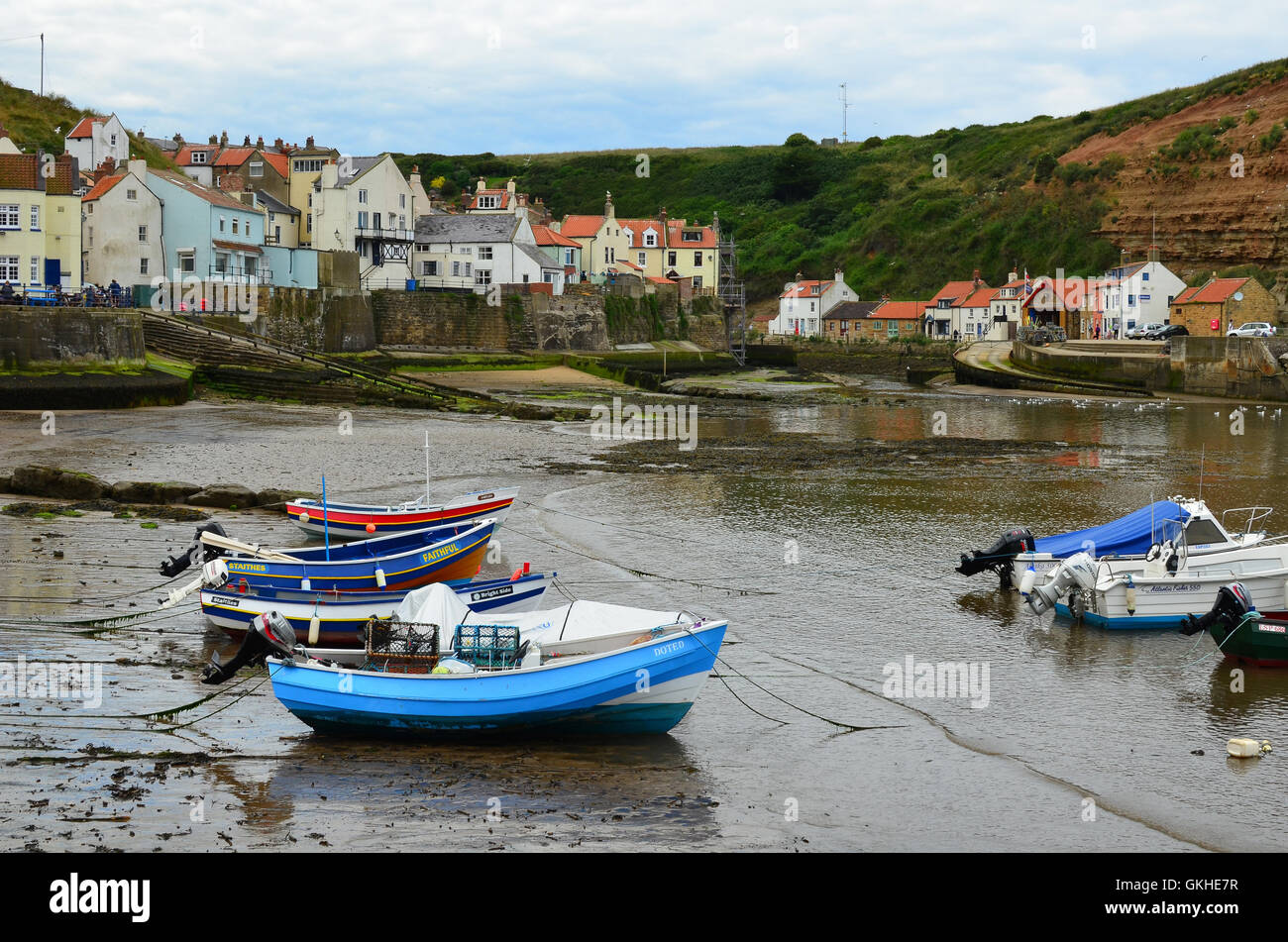 UK, England, Yorkshire, Staithes, fishing boats moored in the harbour ...