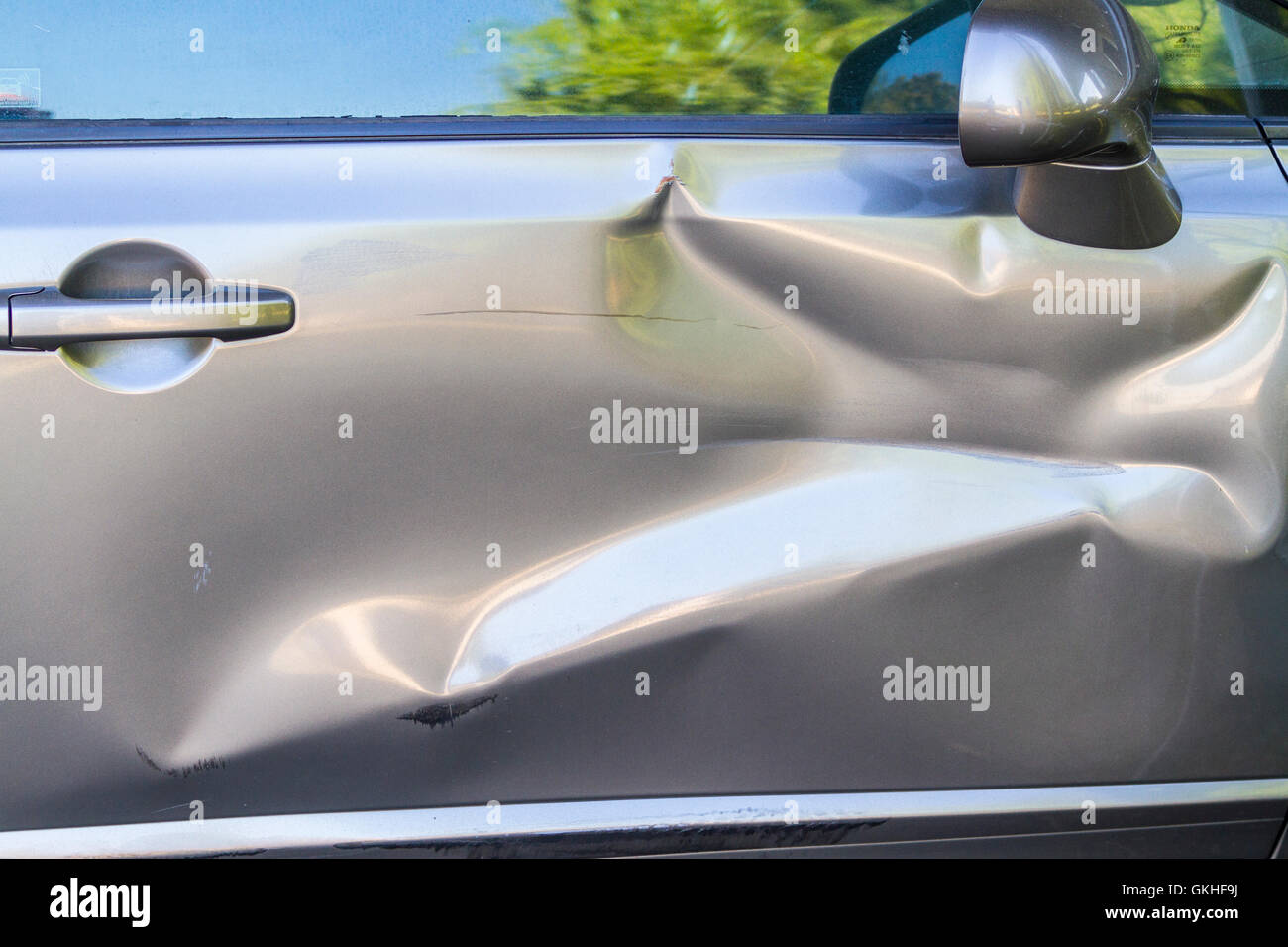 Collision door damage on a 2007 Honda Civic Stock Photo - Alamy