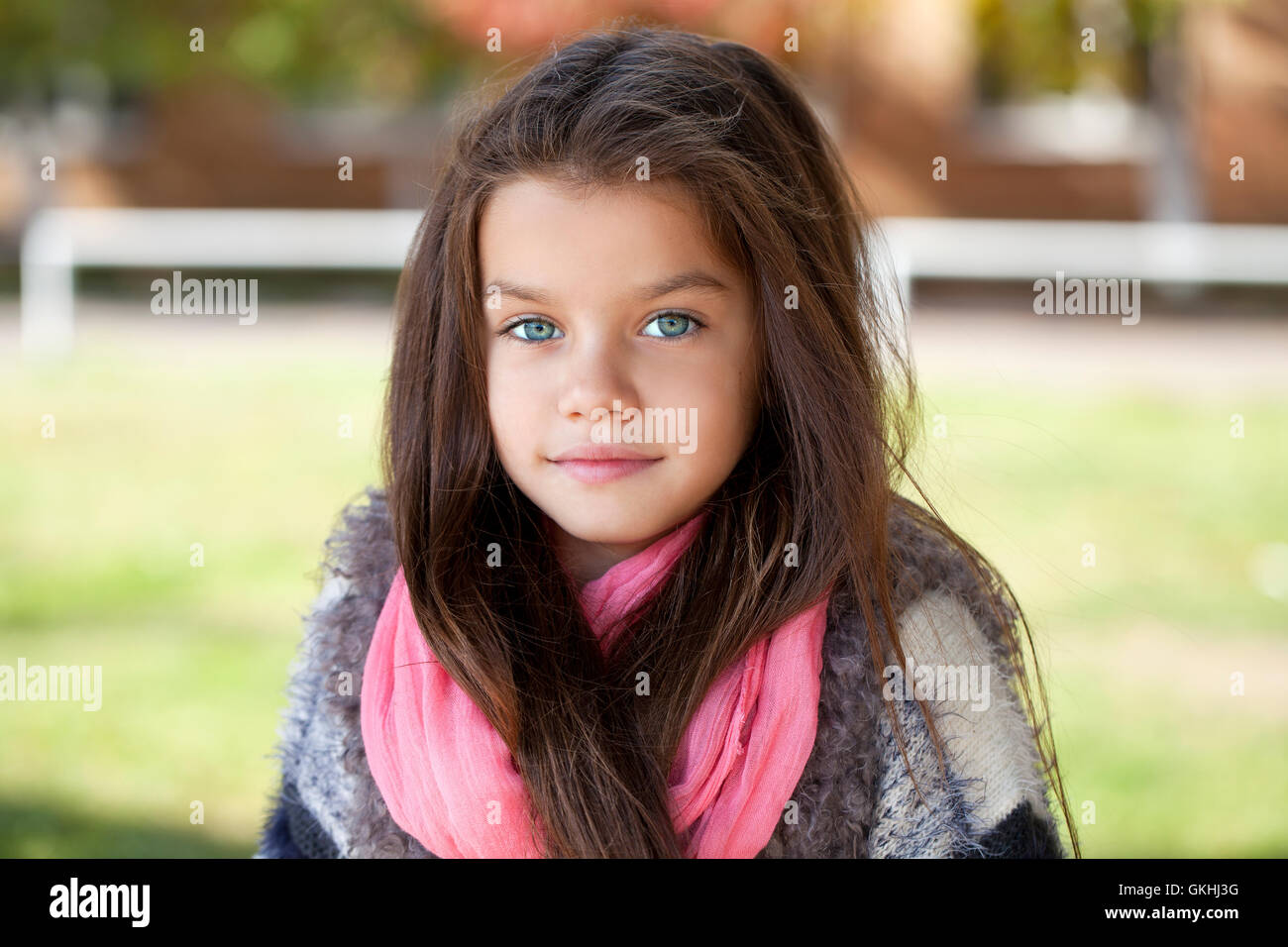 Close up portrait of a beautiful nine year old little girl in autumn ...