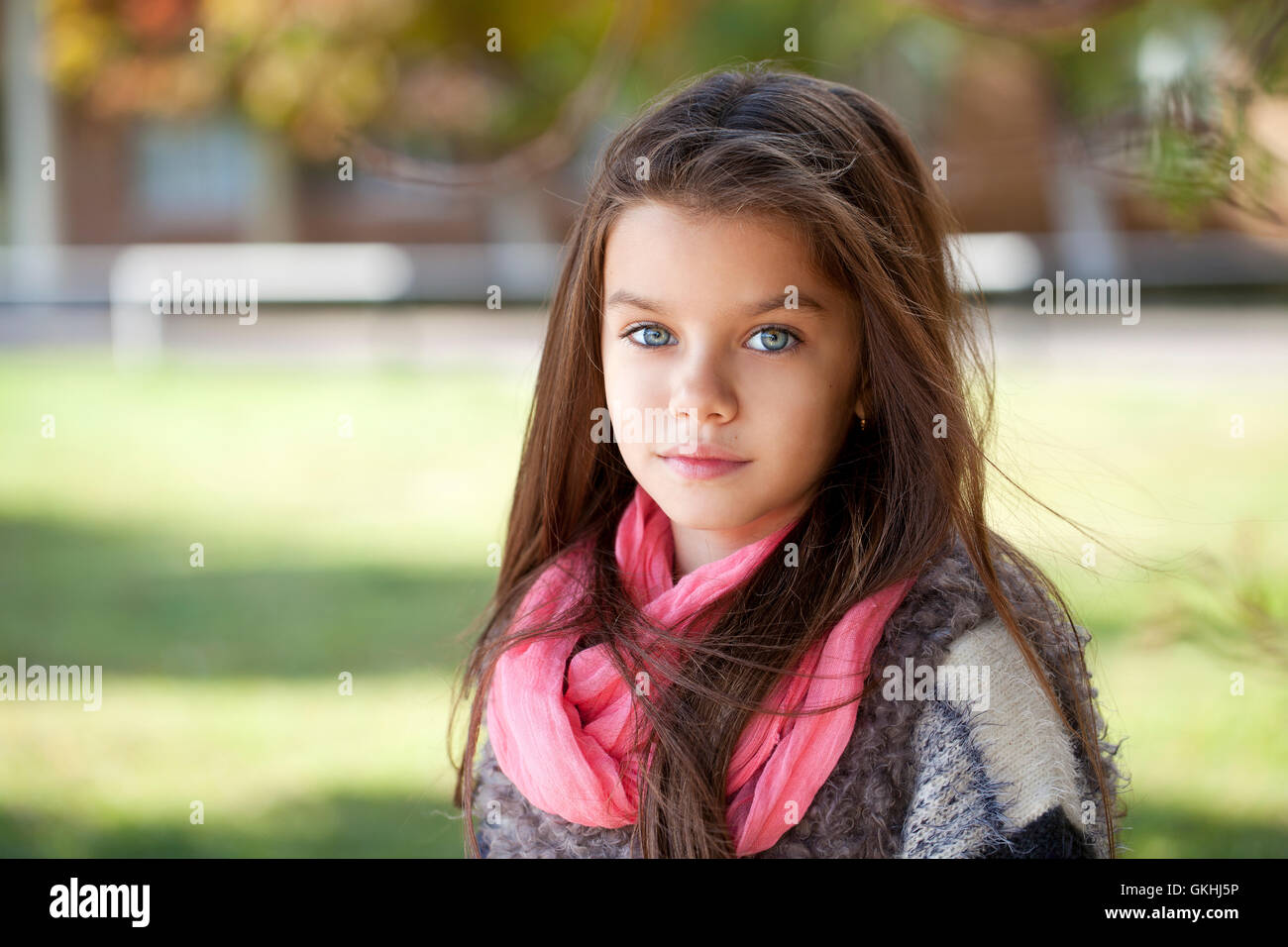 Close up portrait of a beautiful nine year old little girl in autumn ...