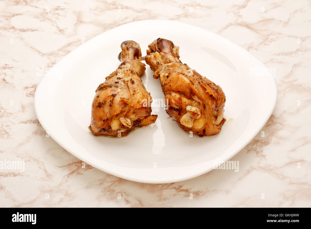 Two Fried Chicken Legs Stock Photo - Alamy