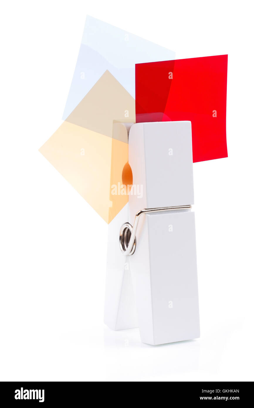 White peg holding three coloured square isolated Stock Photo - Alamy