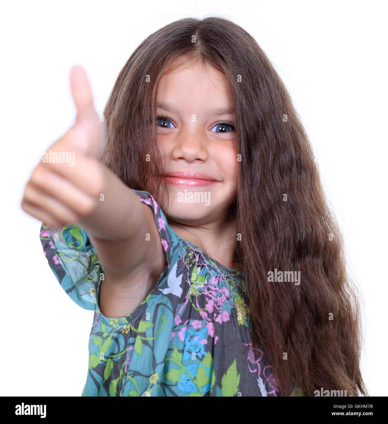 Beautiful little girl shows finger as sign that everything is fine ...
