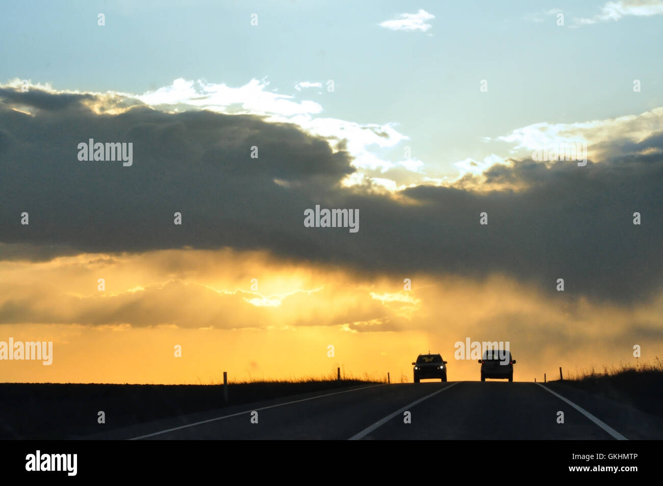 cars at sunset Stock Photo - Alamy