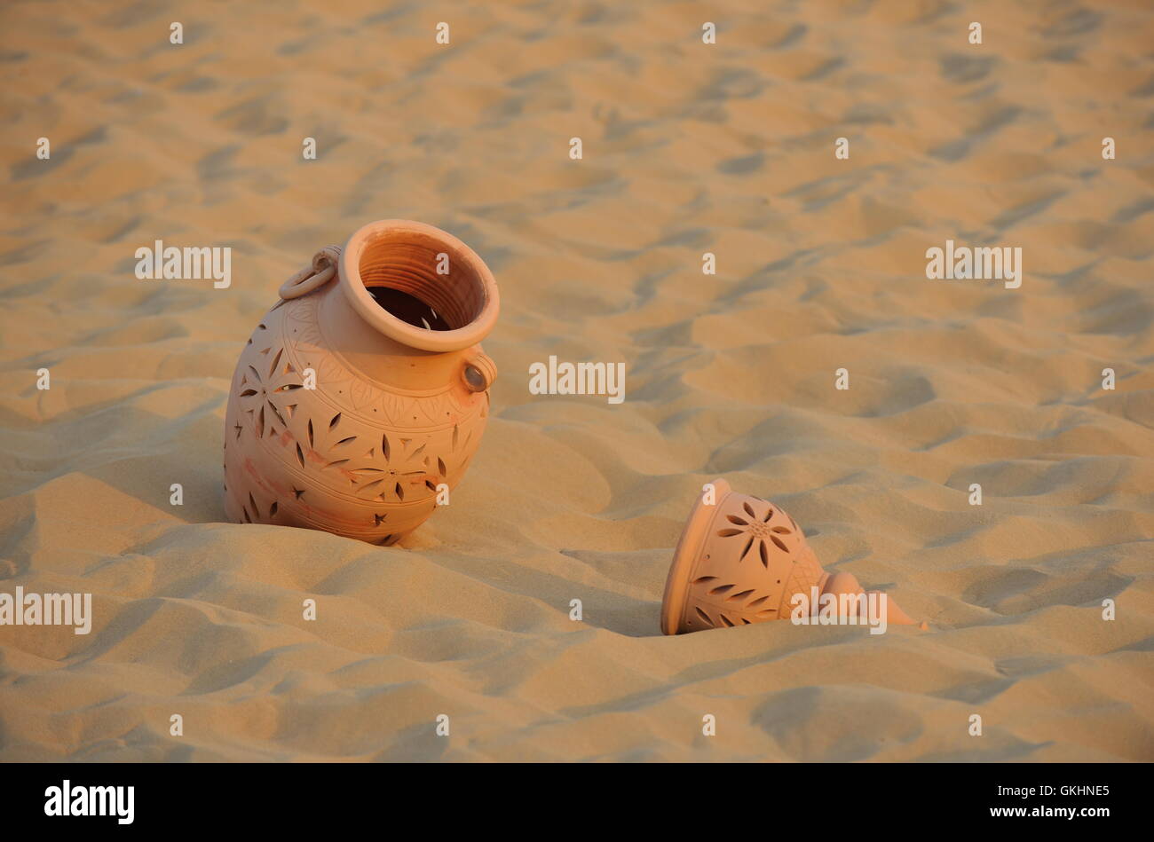 arabic pot in sand Stock Photo - Alamy