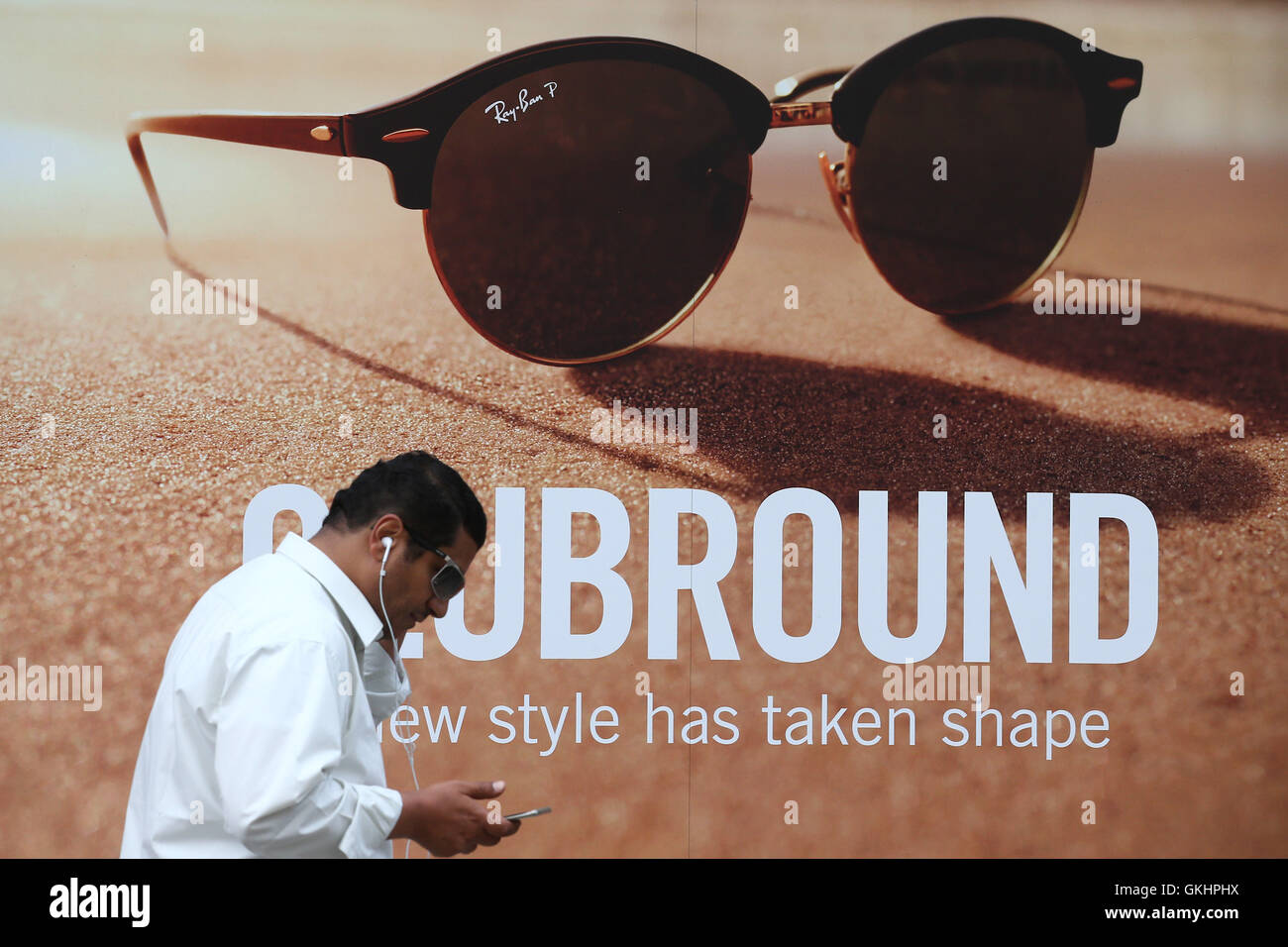UK, London : A person walks past a Ran Ban logo on Oxford Street in ...