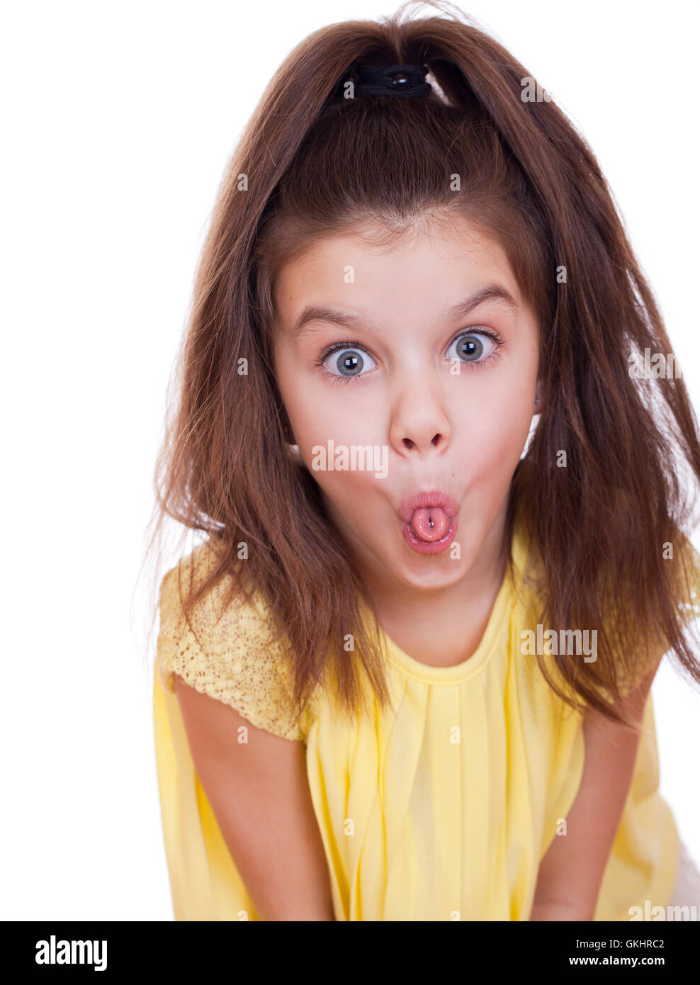 Crazy little girl, studio on white background Stock Photo - Alamy