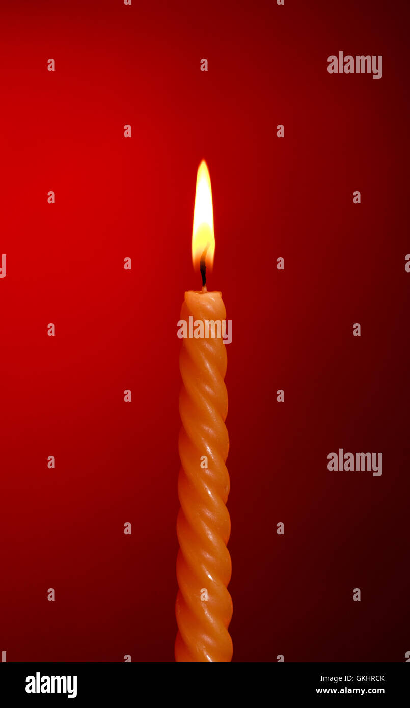 Candle On Red Stock Photo - Alamy