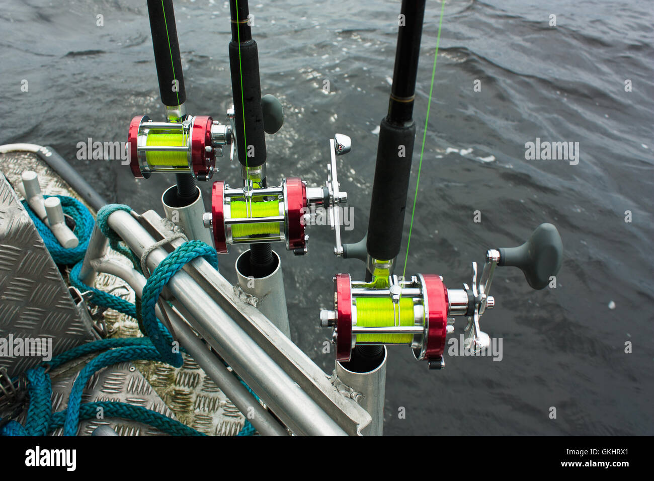 Fishing rods and reels with yellow fishing line Stock Photo - Alamy