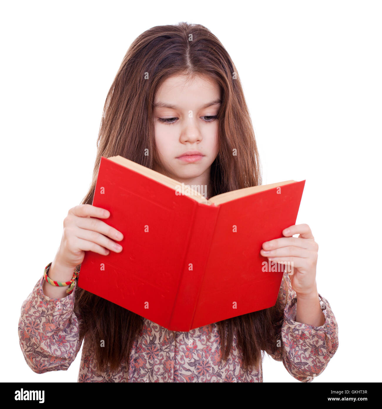 Little girl holding red book, studio on white background Stock Photo ...