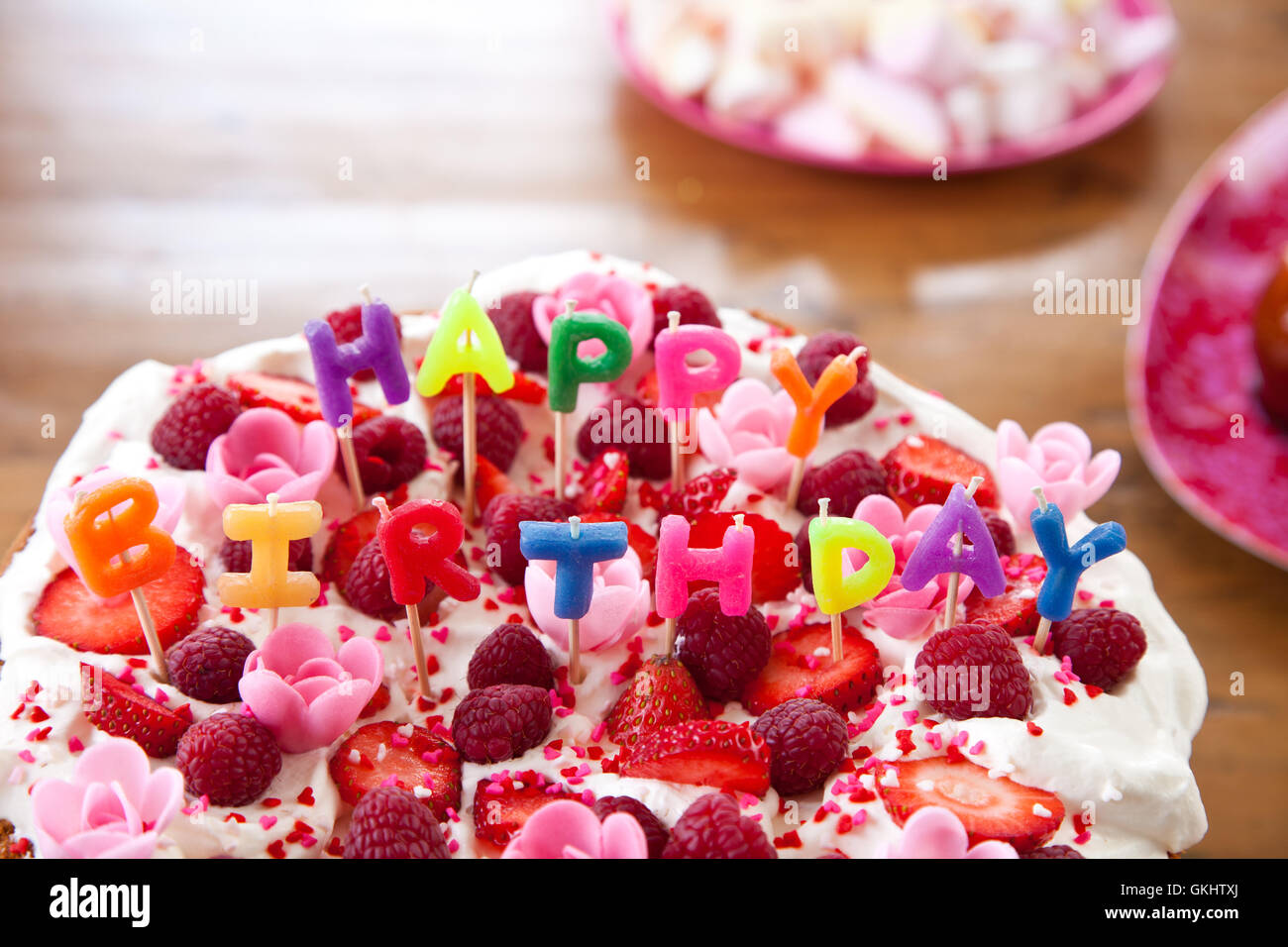 Colorful birthday cake with letters Stock Photo - Alamy
