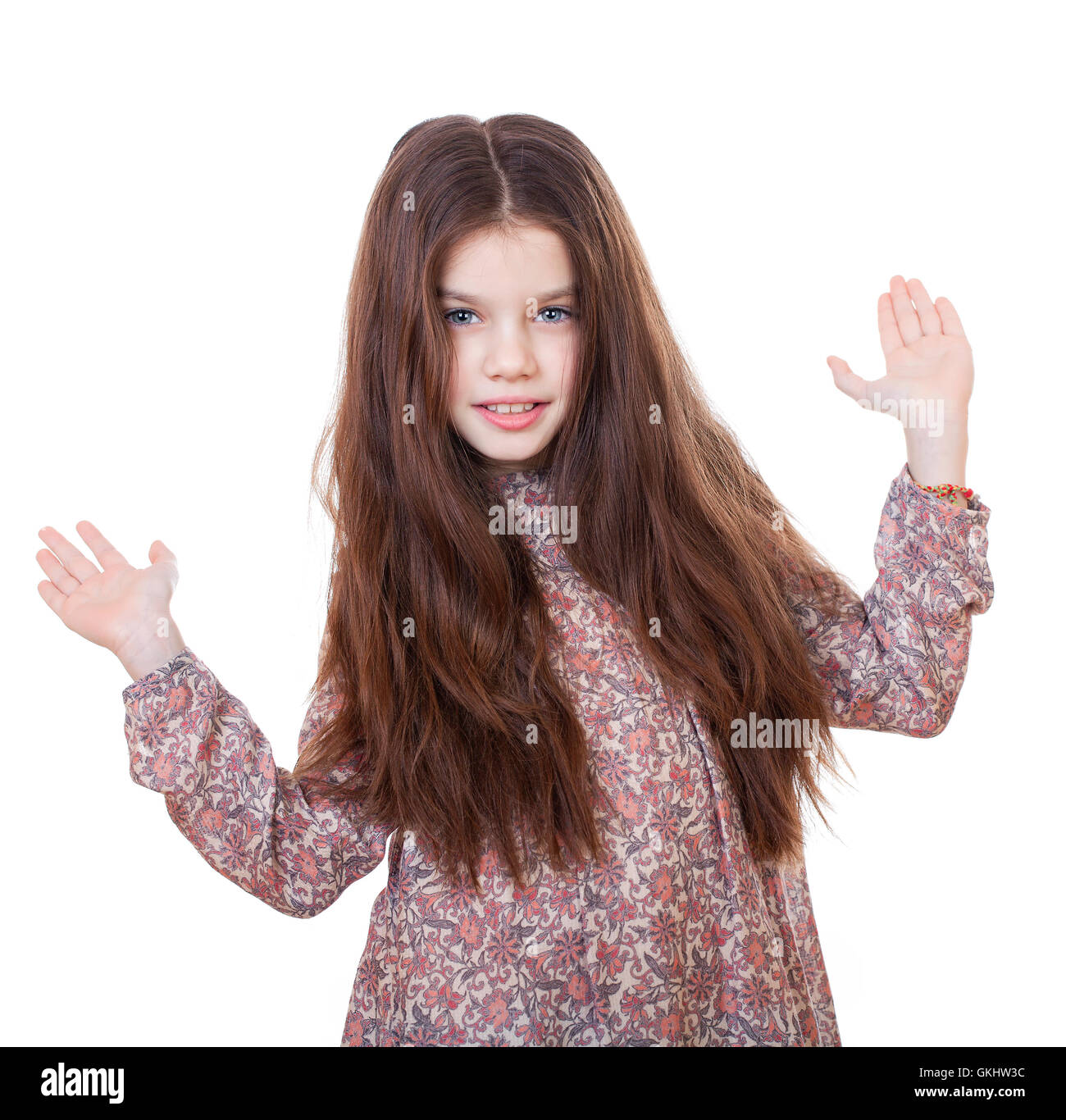 Beautiful little girl has placed his hands in the direction of ...