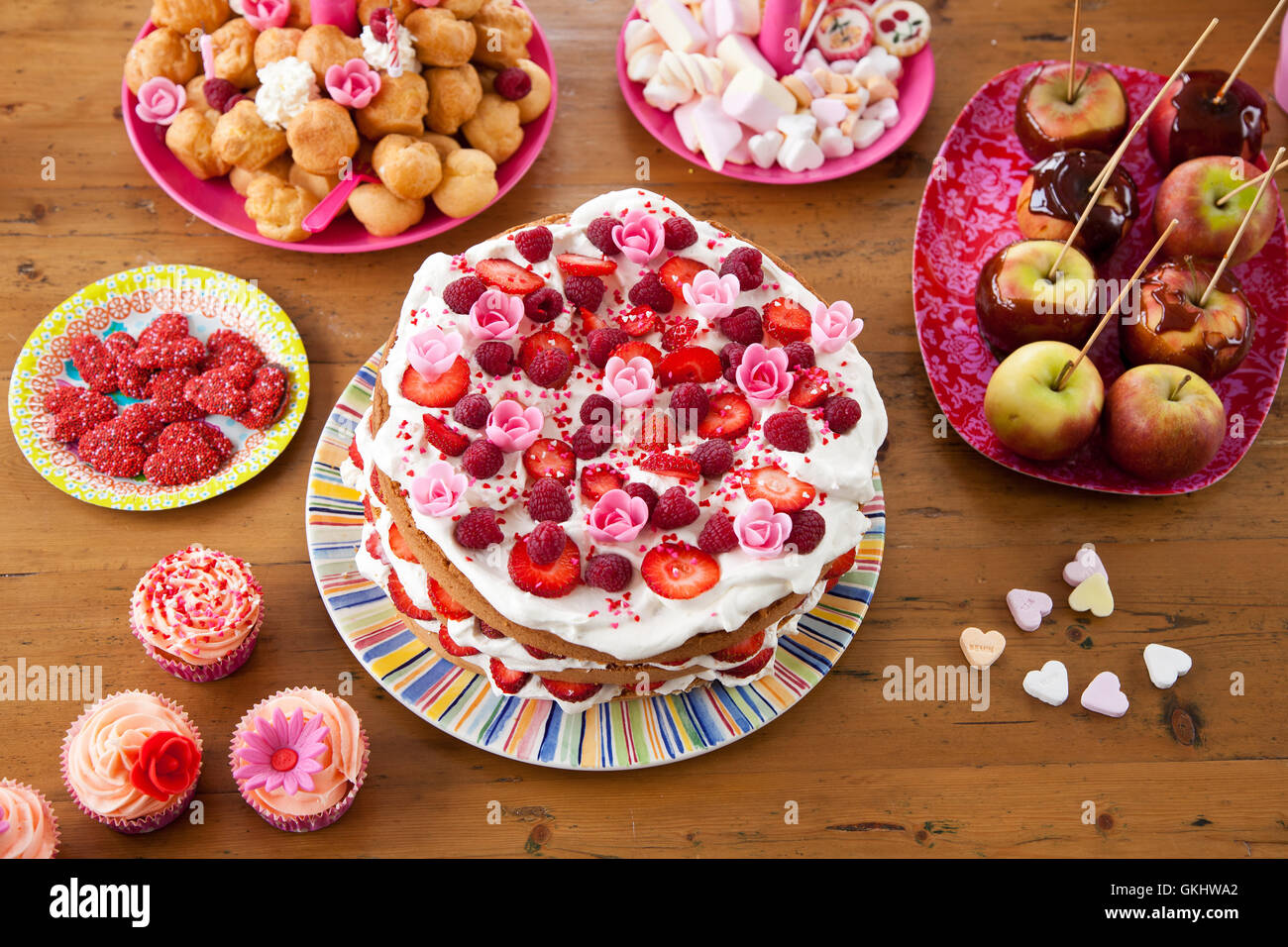 Variety of sweet treats on a table Stock Photo - Alamy