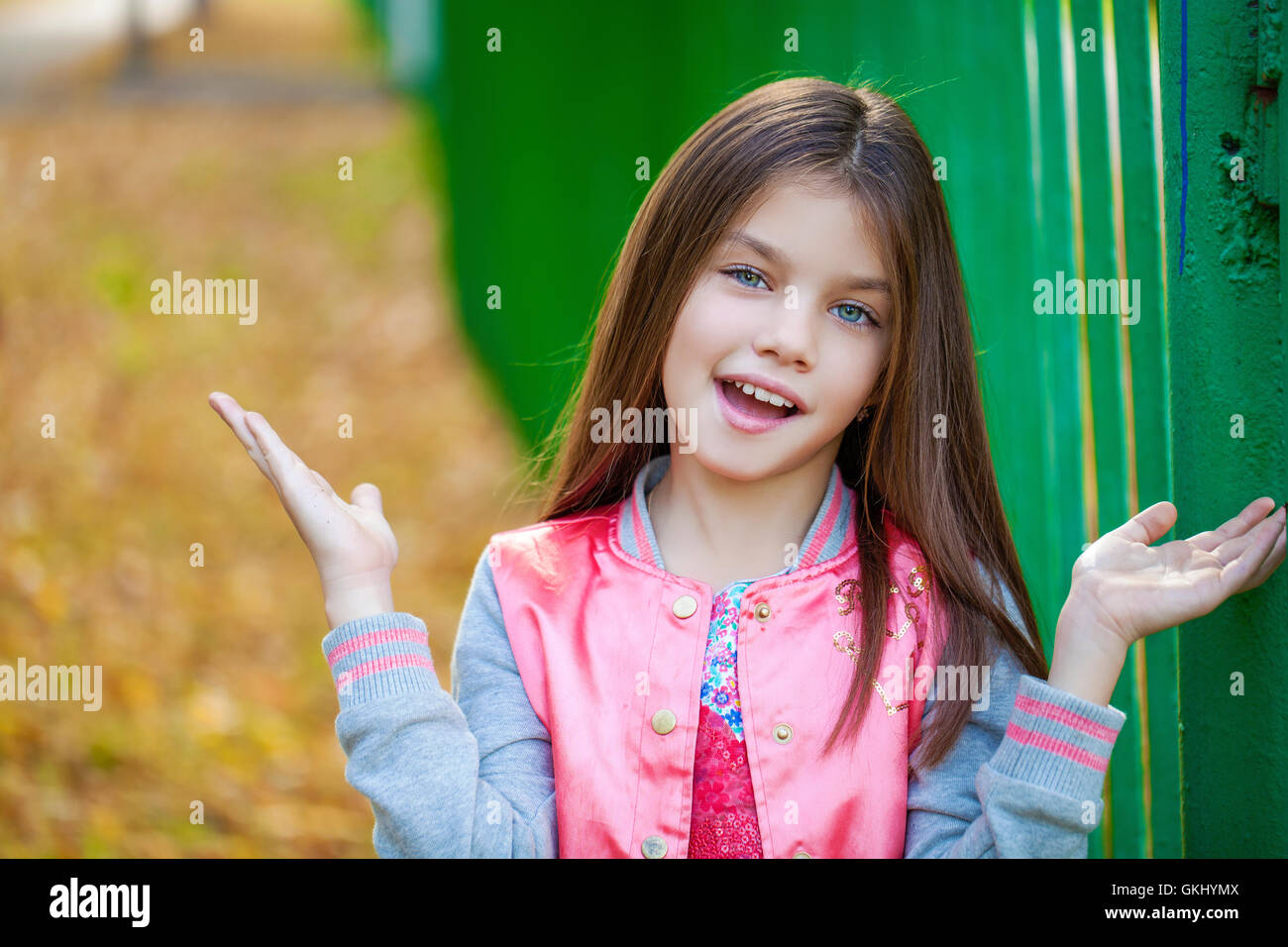 Close up portrait of a beautiful nine year old little girl in autumn ...
